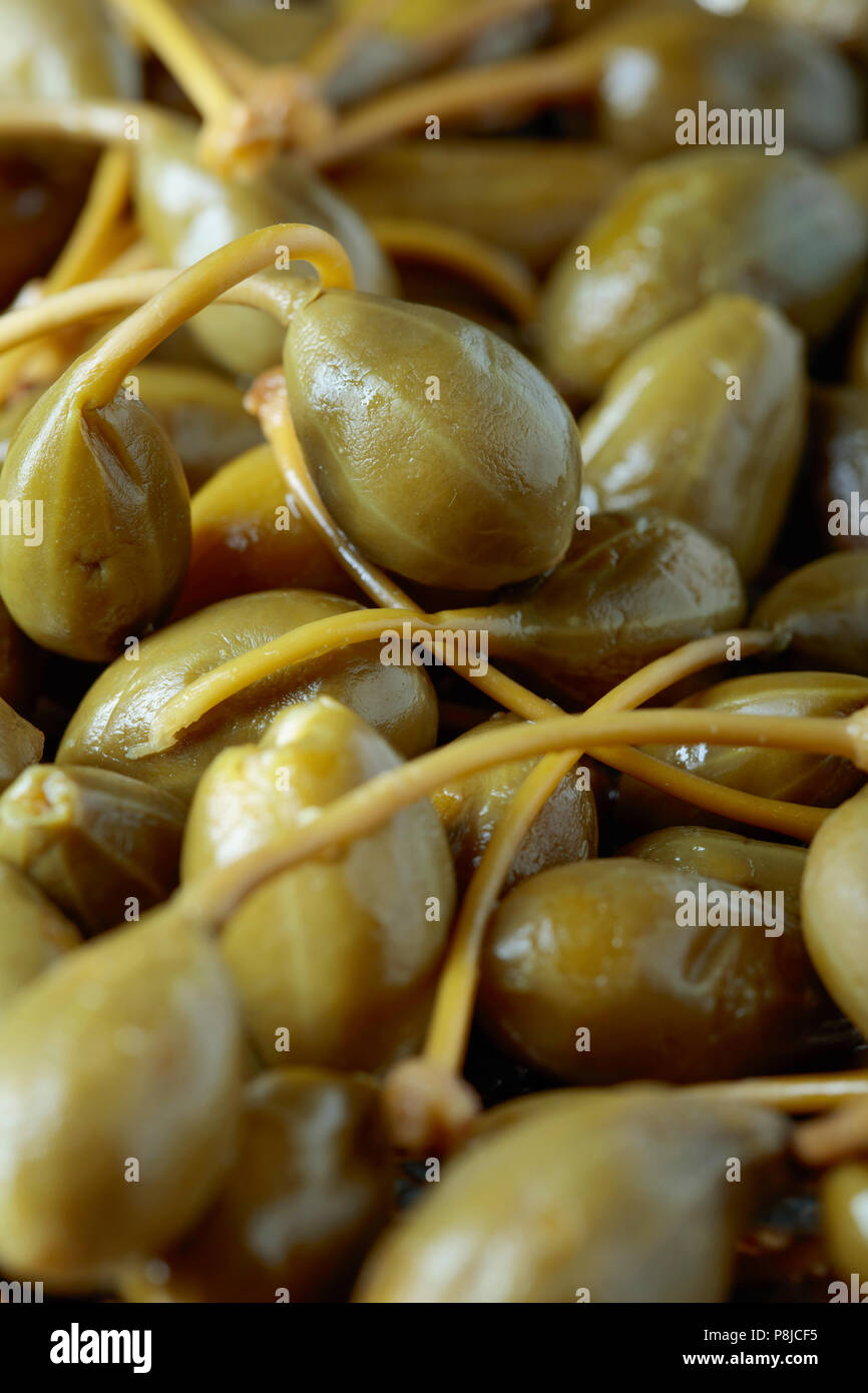 Pickled caper berries . Edible fruits of Capparis . Berries are used as ...