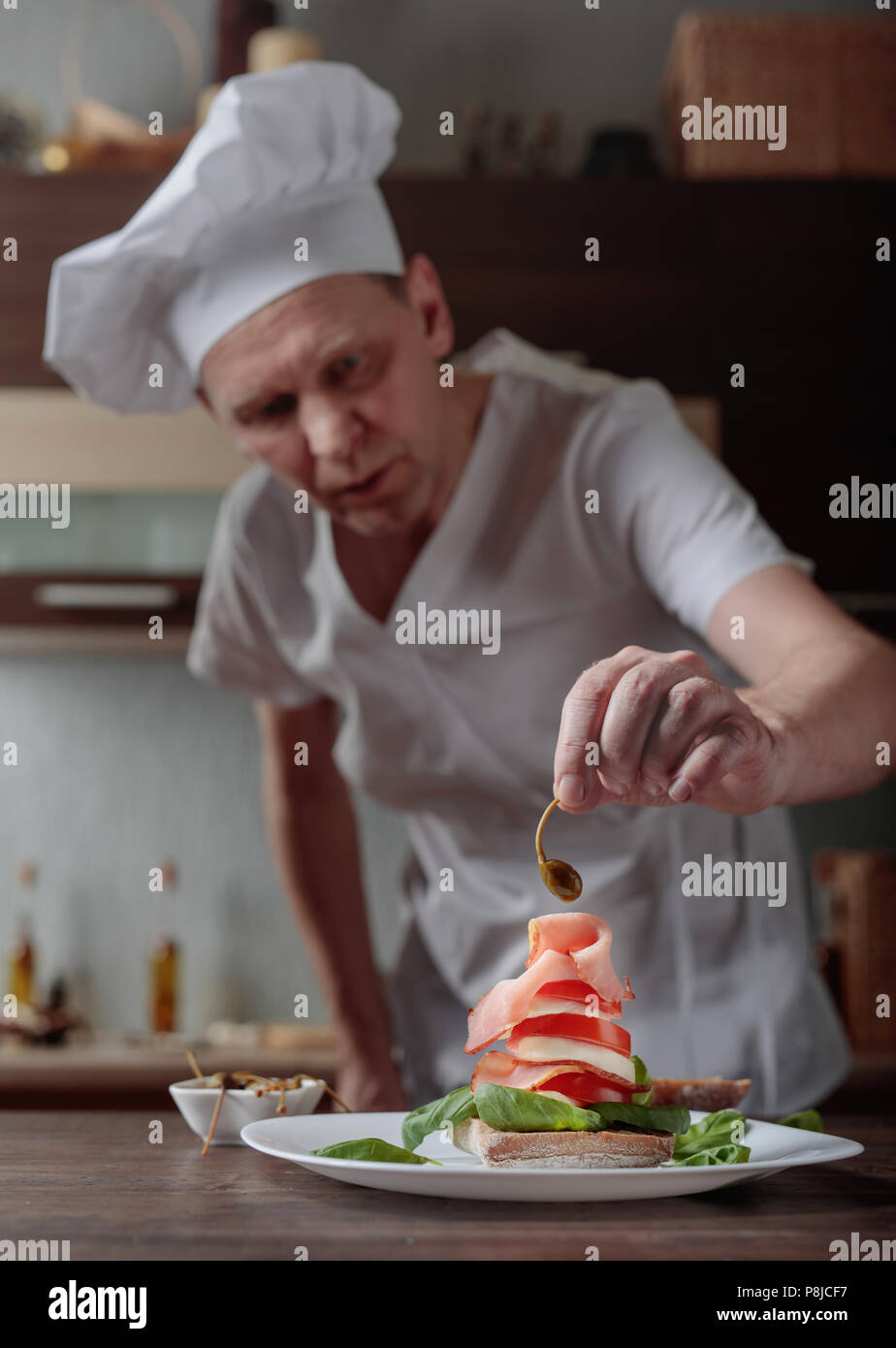 Professional chef prepares red green hi-res stock photography and ...