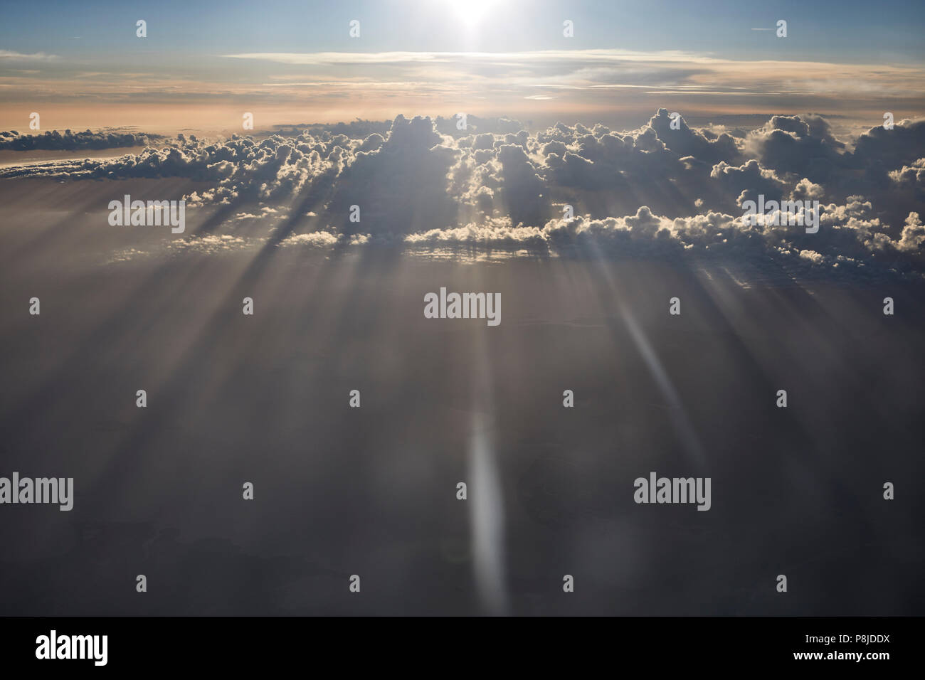 Sun rays shine through the clouds Stock Photo - Alamy