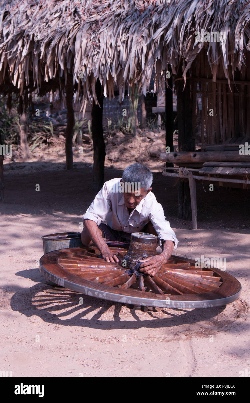 Old burmese cleaning wheel Stock Photo - Alamy