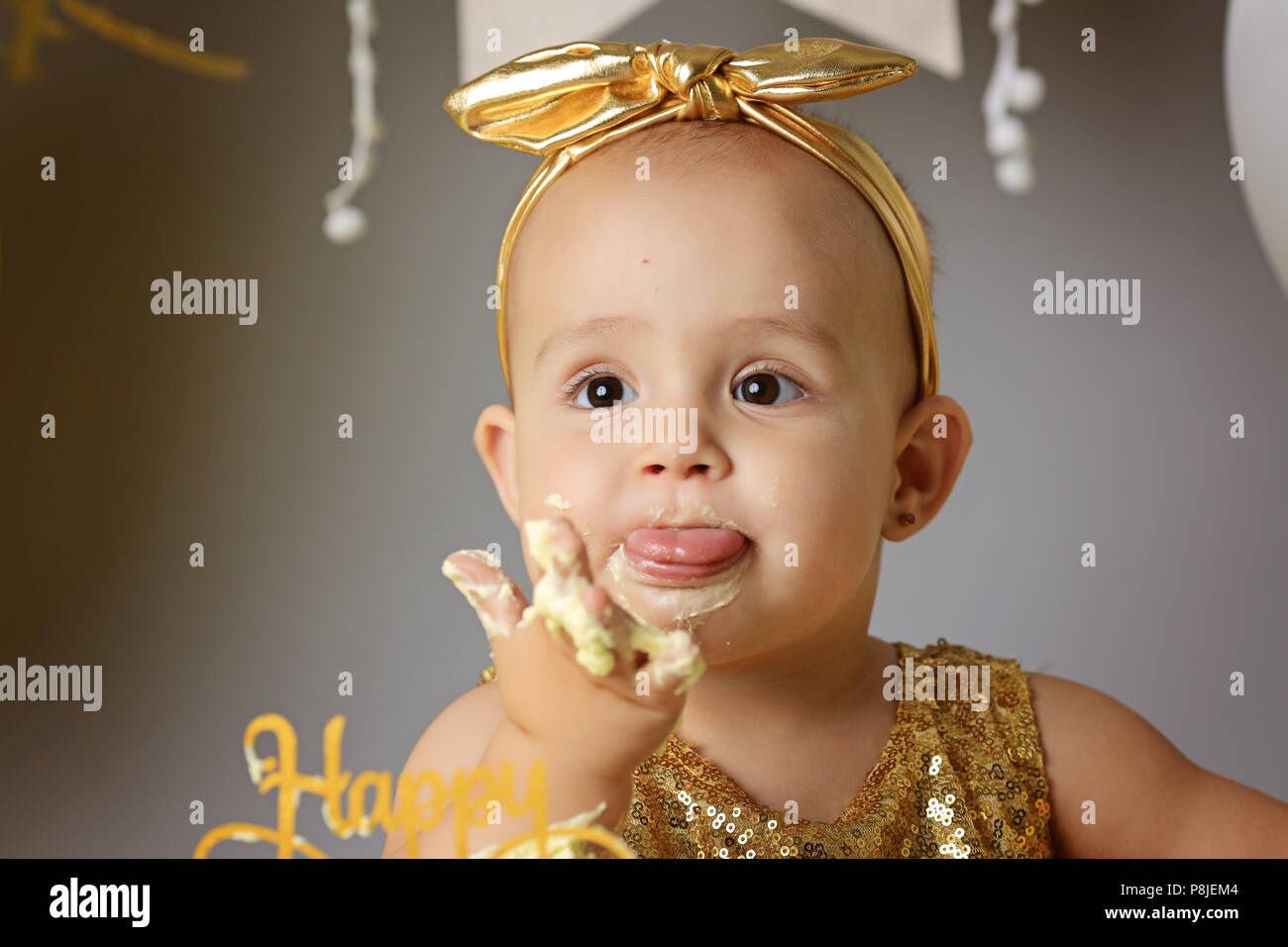Kid eating first birthday cake Stock Photo - Alamy