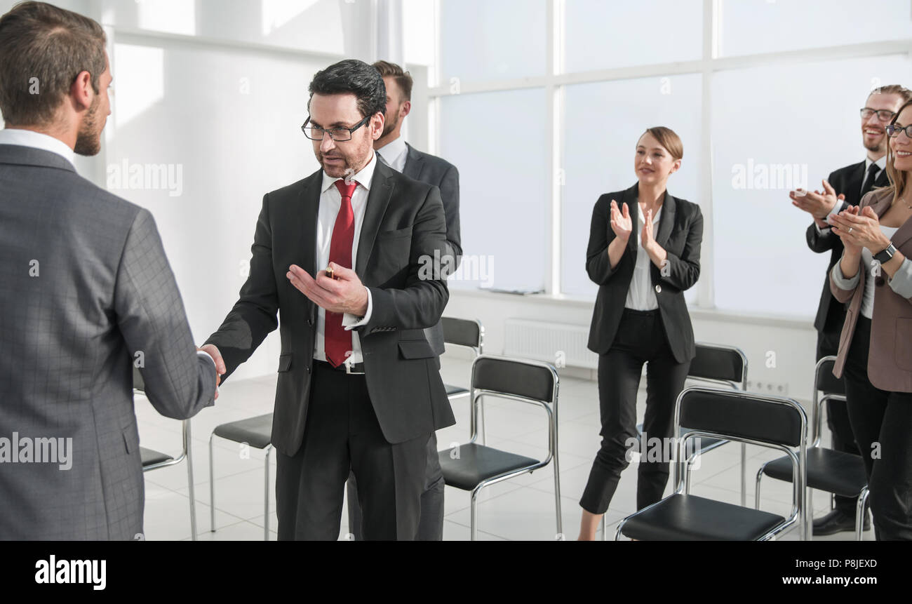 handshake after the completion of a new project plan Stock Photo - Alamy
