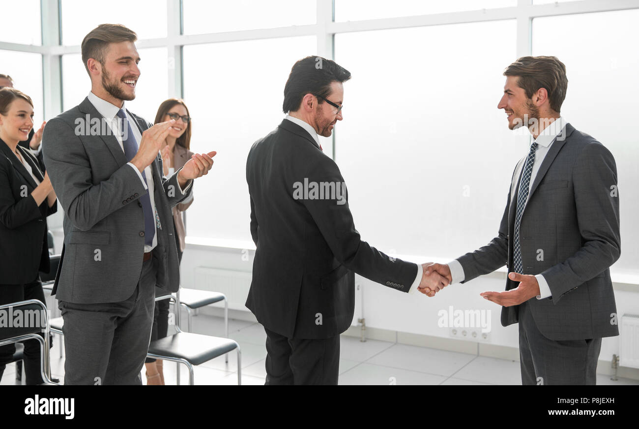 handshake after the completion of a new project plan Stock Photo - Alamy
