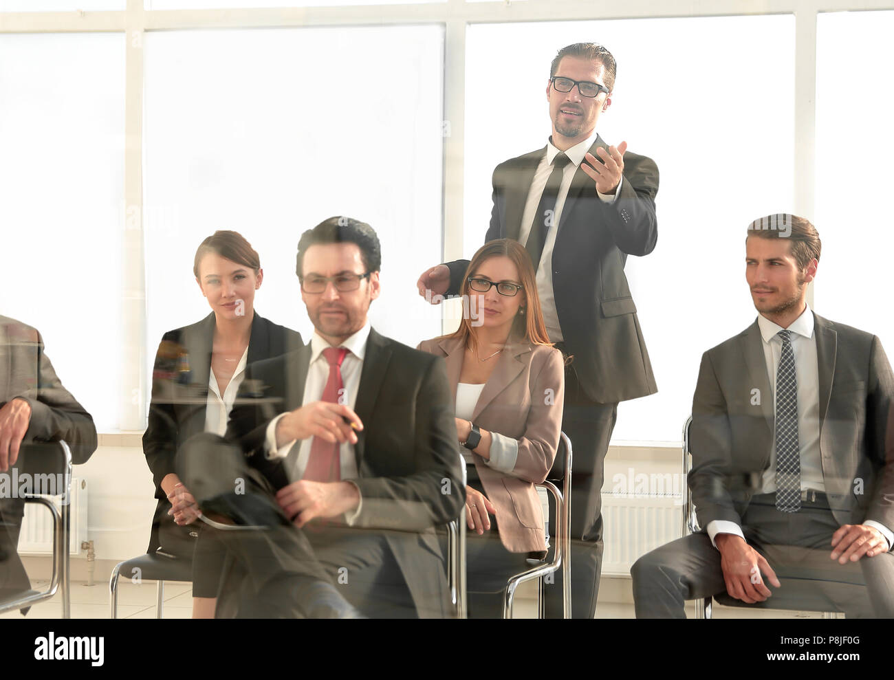 Woman addressing colleagues hi-res stock photography and images - Alamy