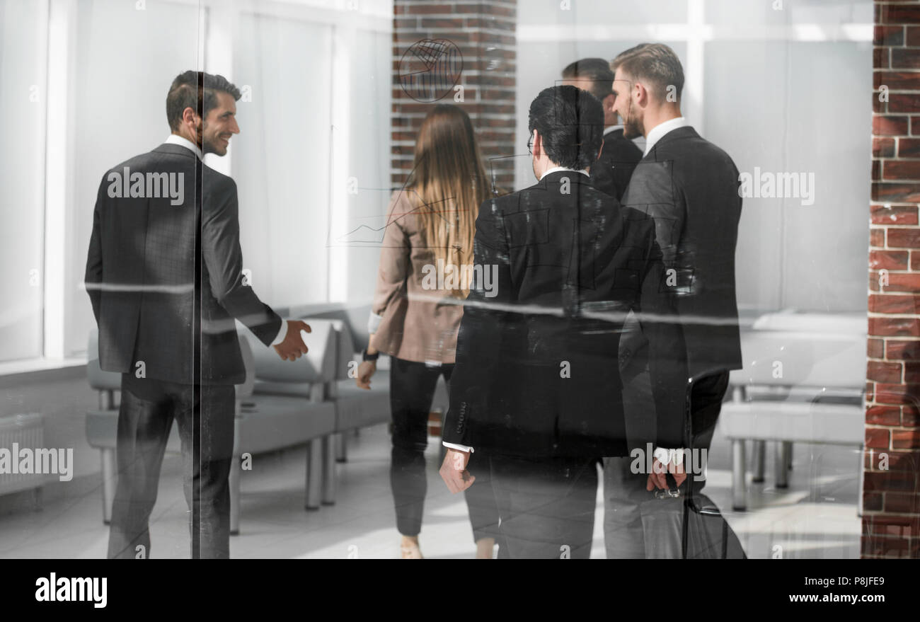 Business people from the back - looking at something Stock Photo - Alamy