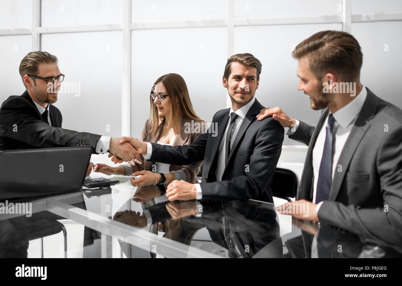 Young boss with employees during business meeting Stock Photo - Alamy