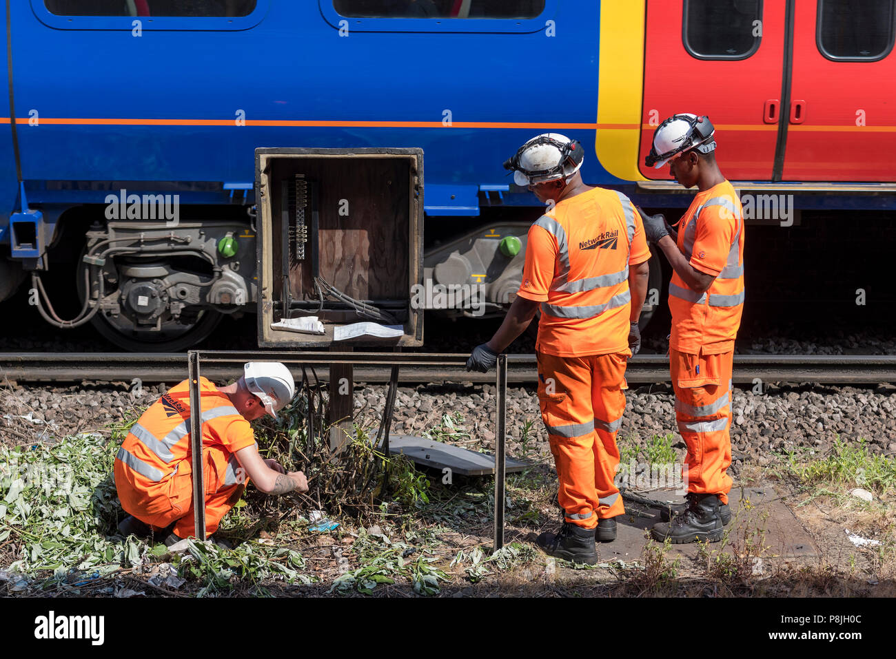 network rail workers on the railway track Stock Photo - Alamy