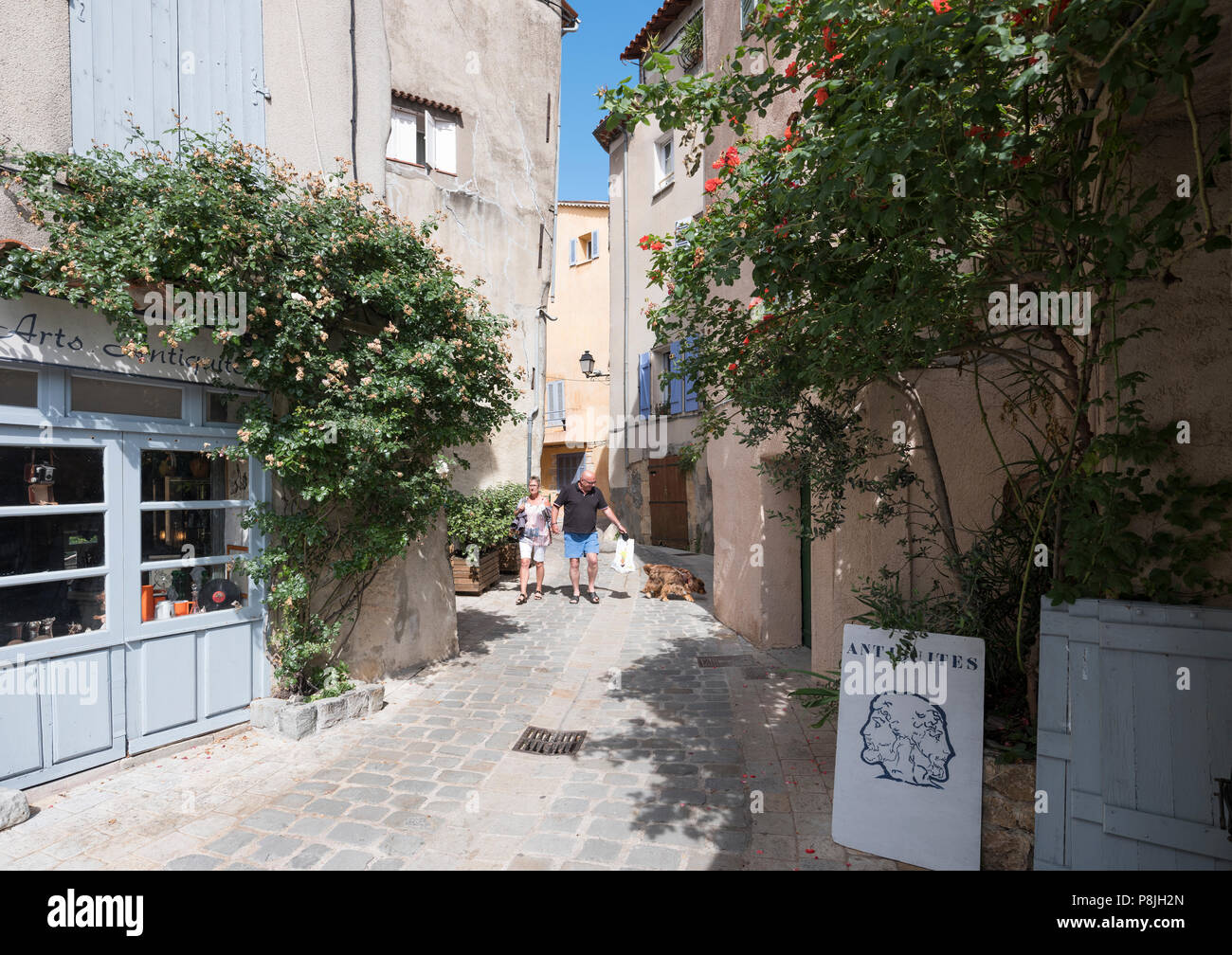 bargemon, france, 13 june 2018: tourists shop in old medieval center of ...