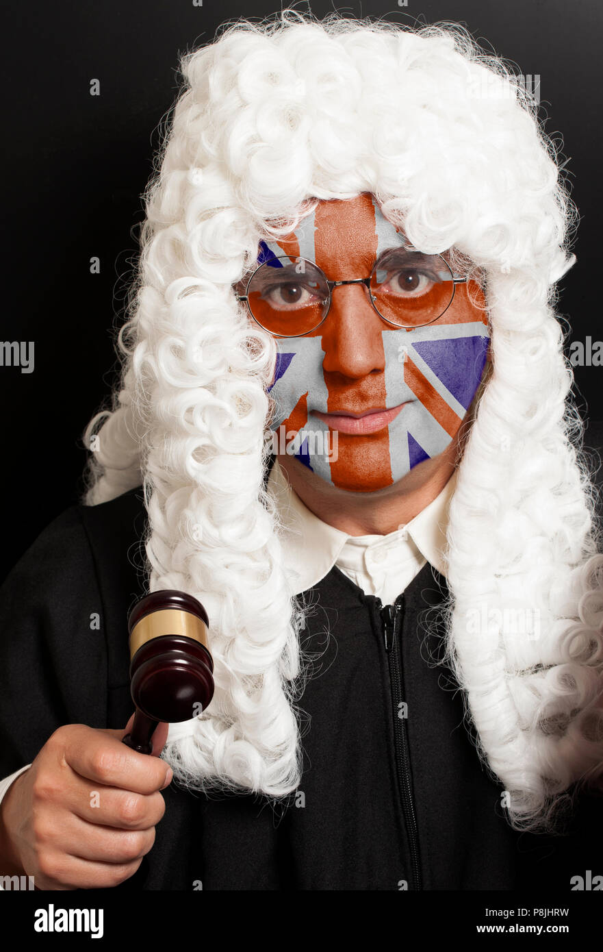Portrait of male english lawyer with painted British Union Jack flag ...