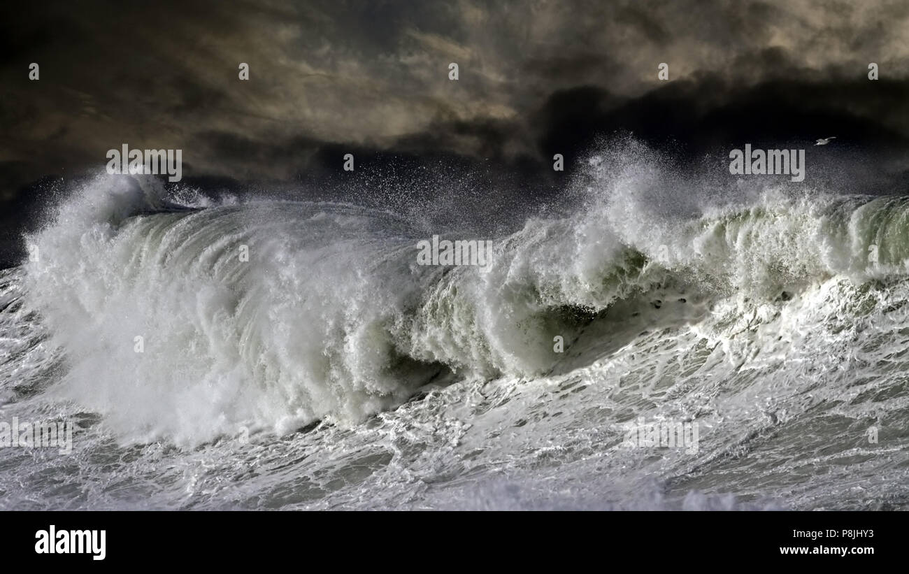 Big Atlantic wave over Portuguese cost. Enhanced sky Stock Photo - Alamy
