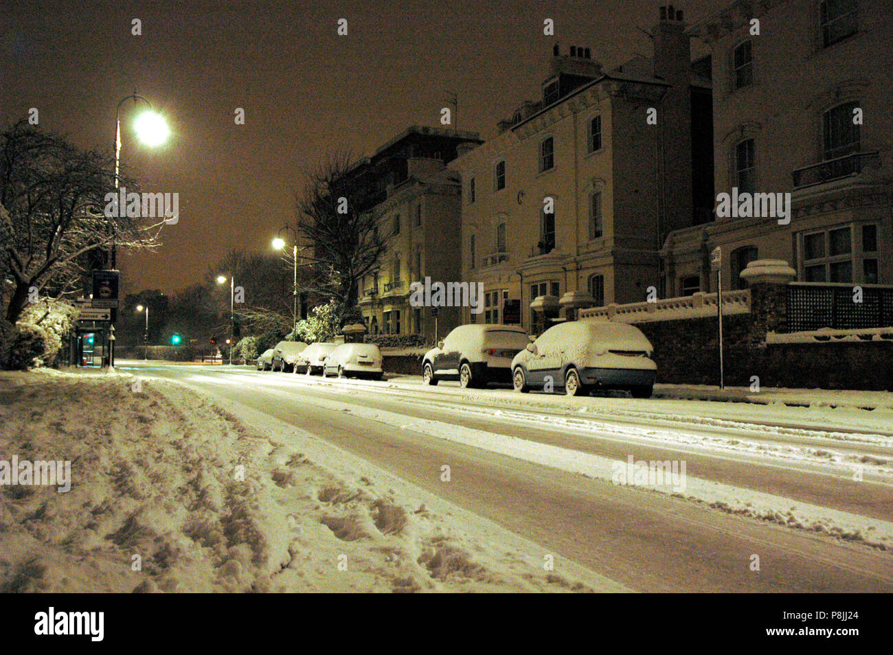 Snow covered streets at night time in Primrose Hill, NW London, England ...