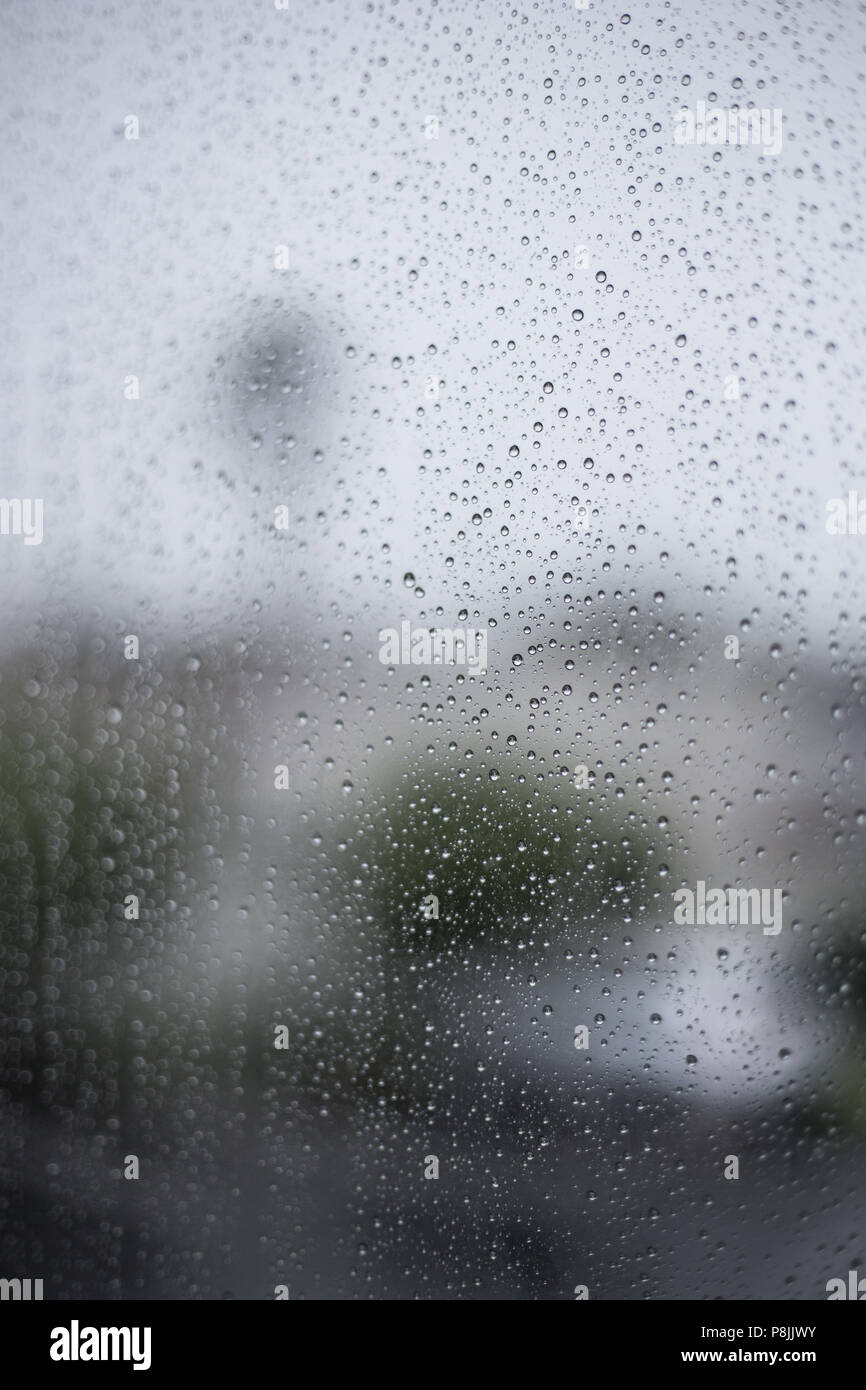 Raindrops On Glass Window Background Stock Photo - Alamy