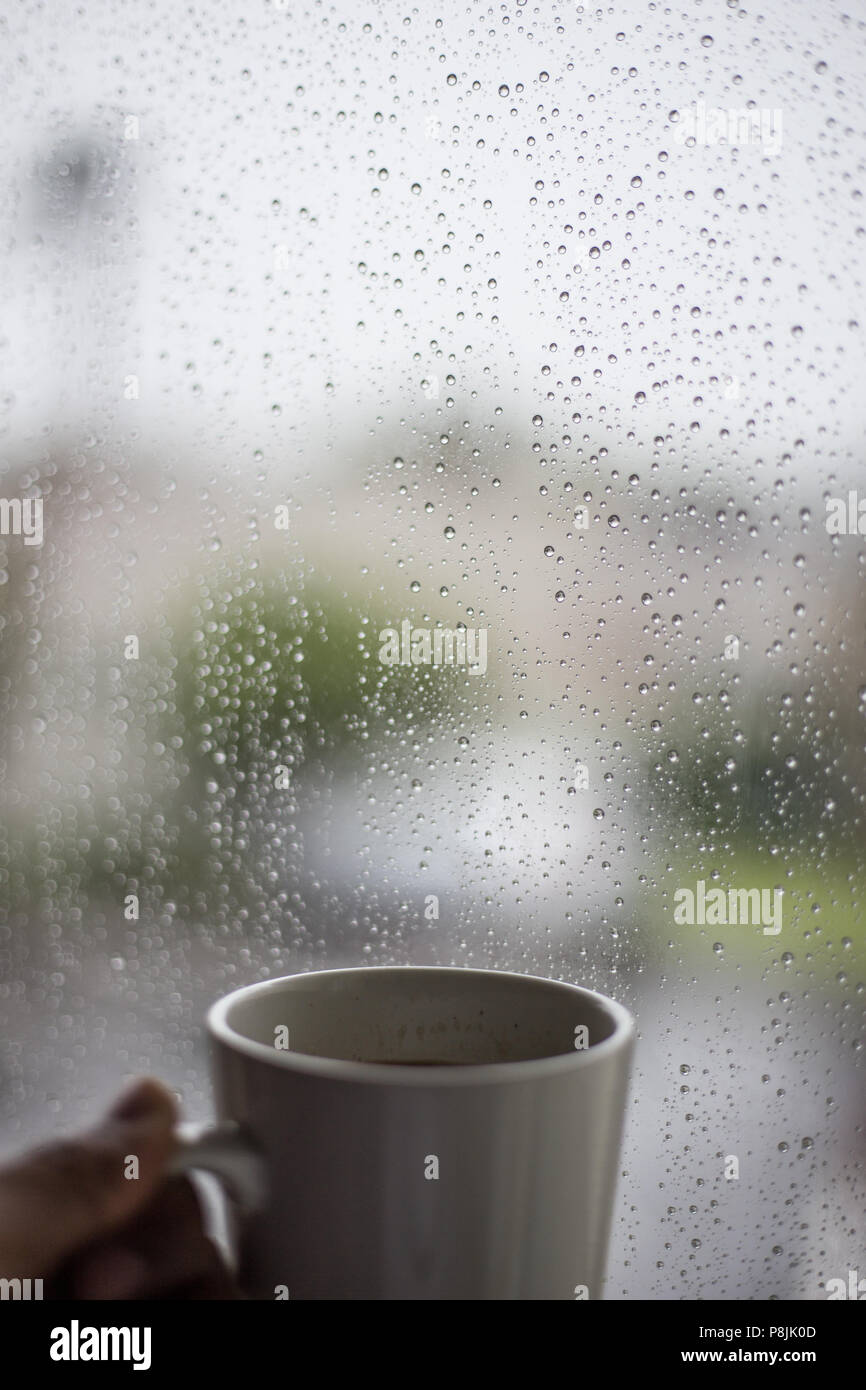 Glass Raindrops window cup of coffee winter Stock Photo - Alamy