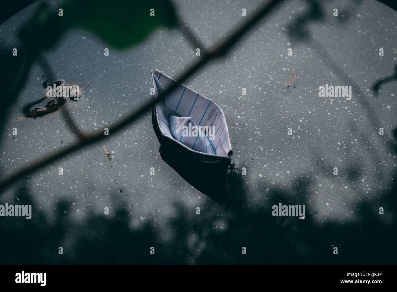 Paper boat origami on water Stock Photo - Alamy