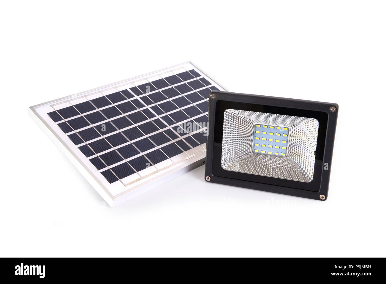 Small solar panel and spotlight is alternative energy for home on white ...