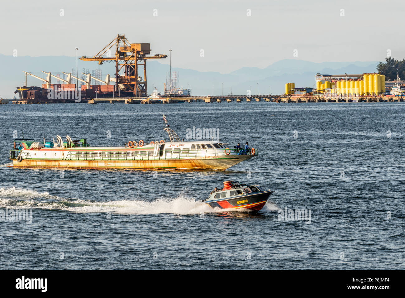 Fast ferries in Labuan harbour they bring people to and from the duty ...