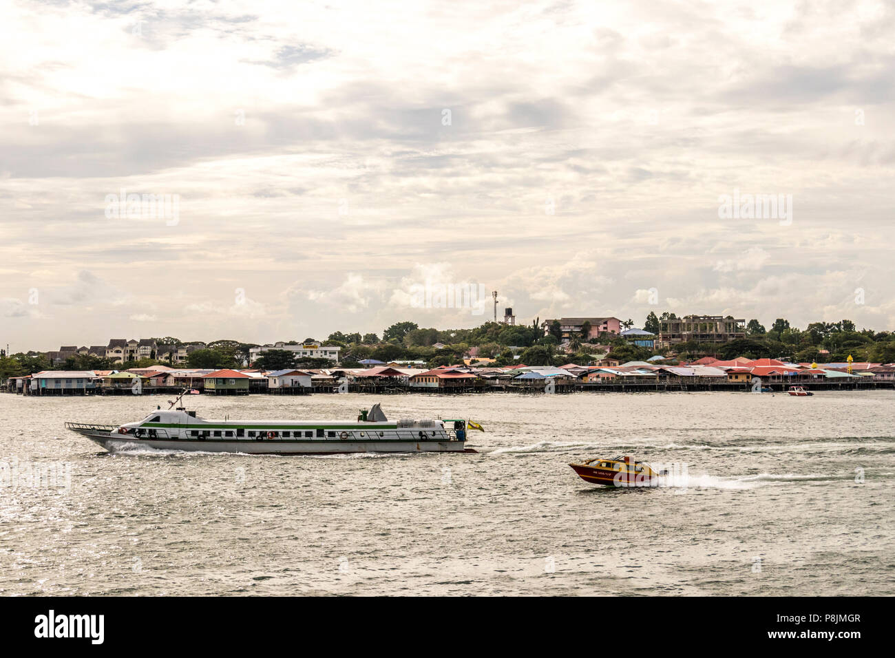 Fast ferries in Labuan harbour they bring people to and from the duty ...