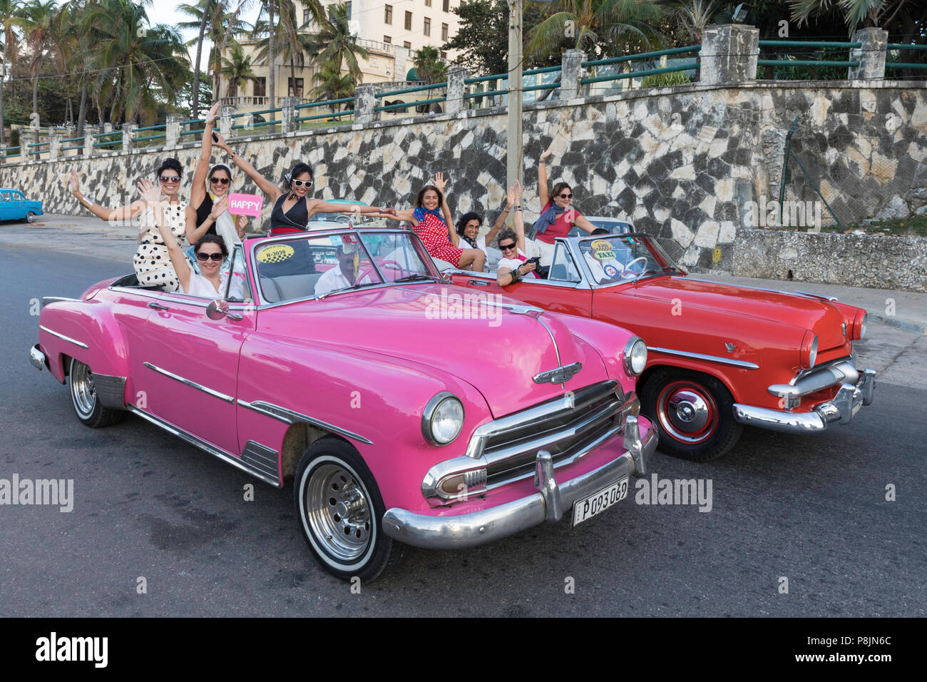 Women in red and car hi-res stock photography and images - Alamy