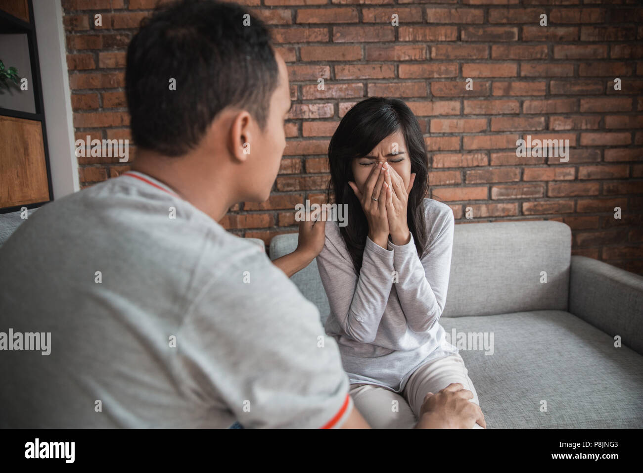 Young Man Comforting Crying Sad Woman Caring Husband Showing Empathy