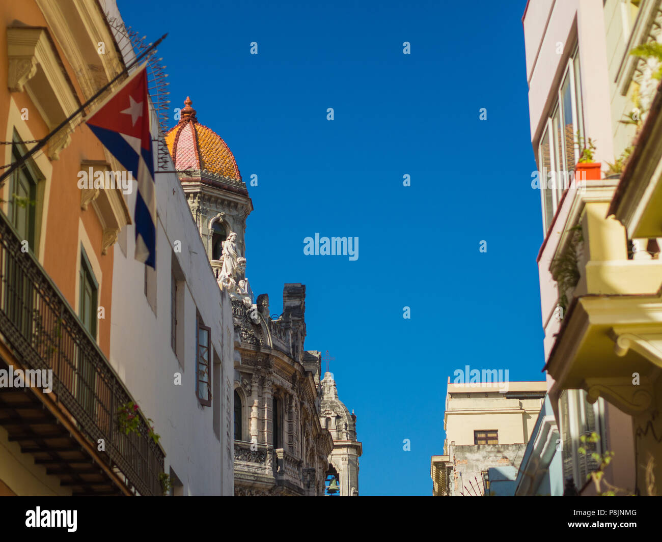 Havana streets with bright colours and cuban flags in sunny day Stock ...
