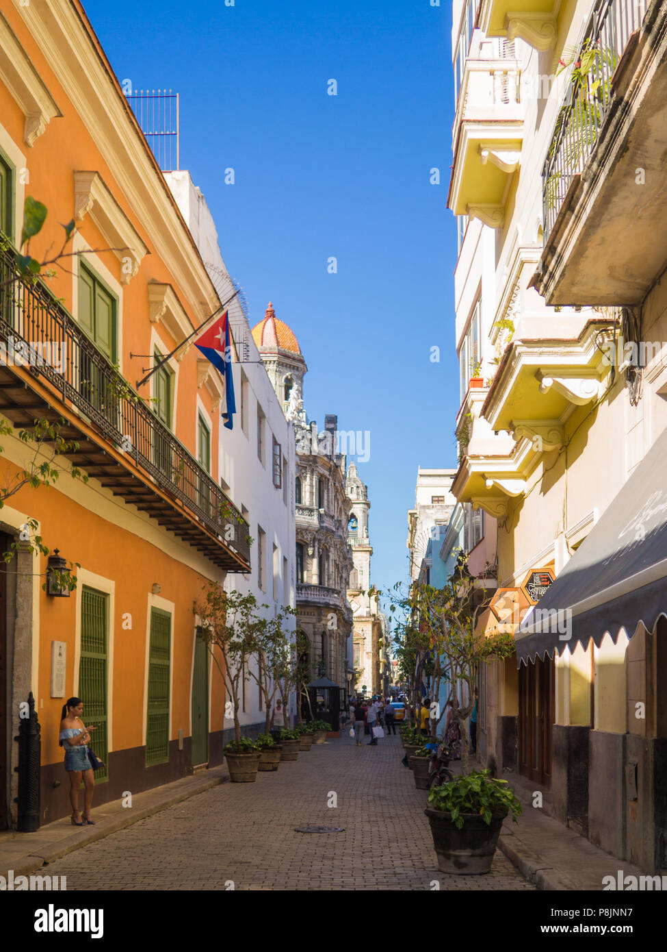 Havana streets with bright colours and cuban flags in sunny day Stock ...