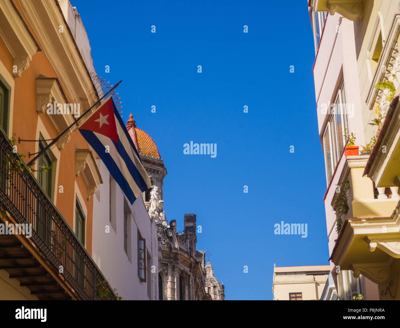Havana streets with bright colours and cuban flags in sunny day Stock ...