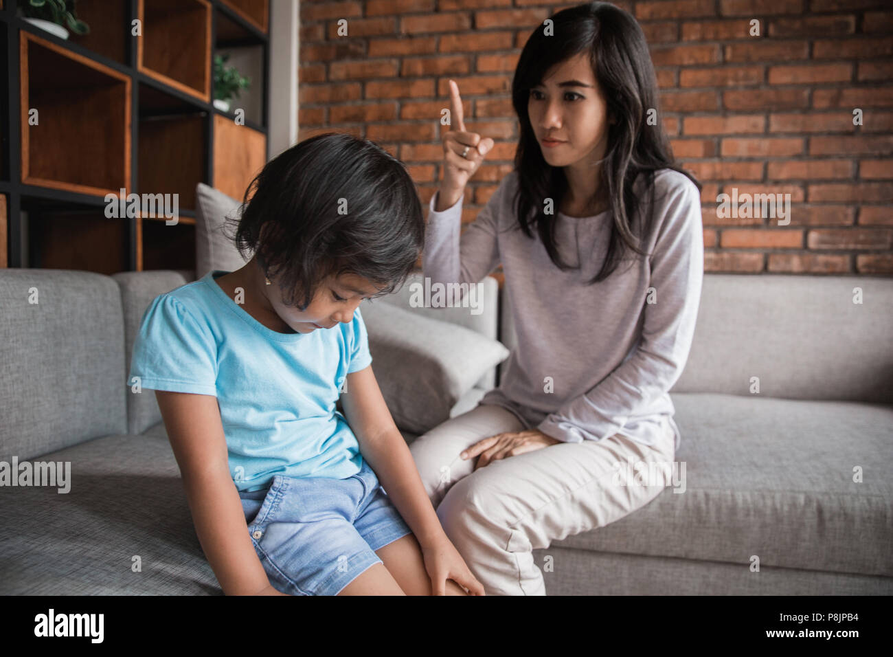 mother rebuking a little child for bad behavior. scolding her daughter Stock Photo - Alamy