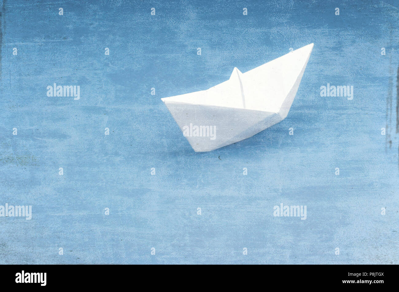 white paper origami sailing boat on a blue sea Stock Photo - Alamy