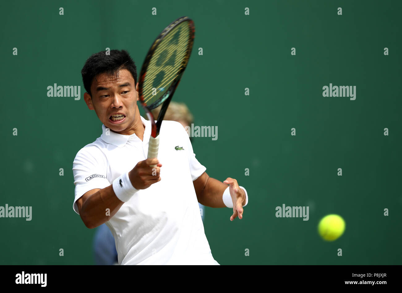 Tao Mu in action on day ten of the Wimbledon Championships at the All ...