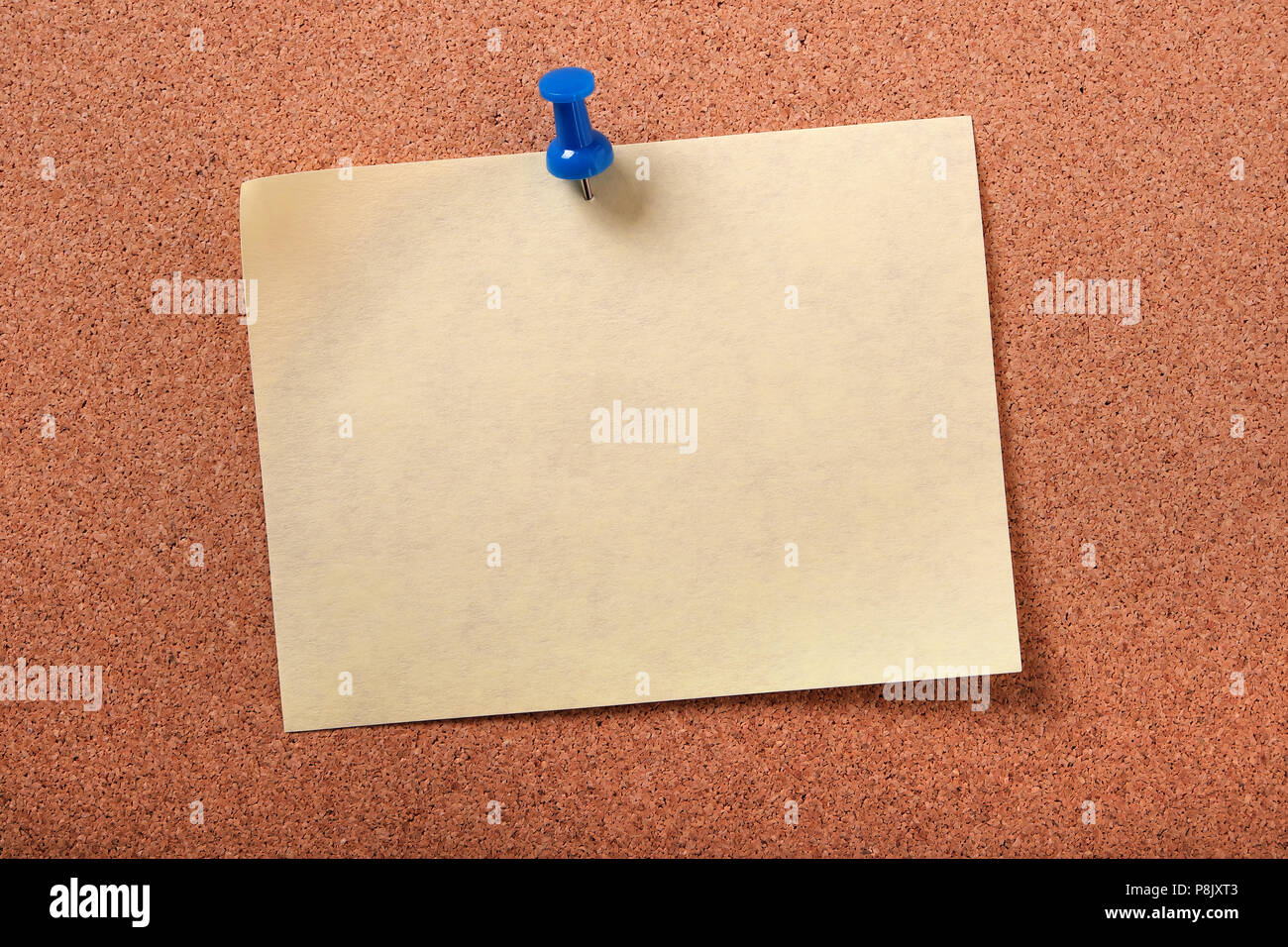 Single yellow sticky post note pinned pushpin cork board Stock Photo ...
