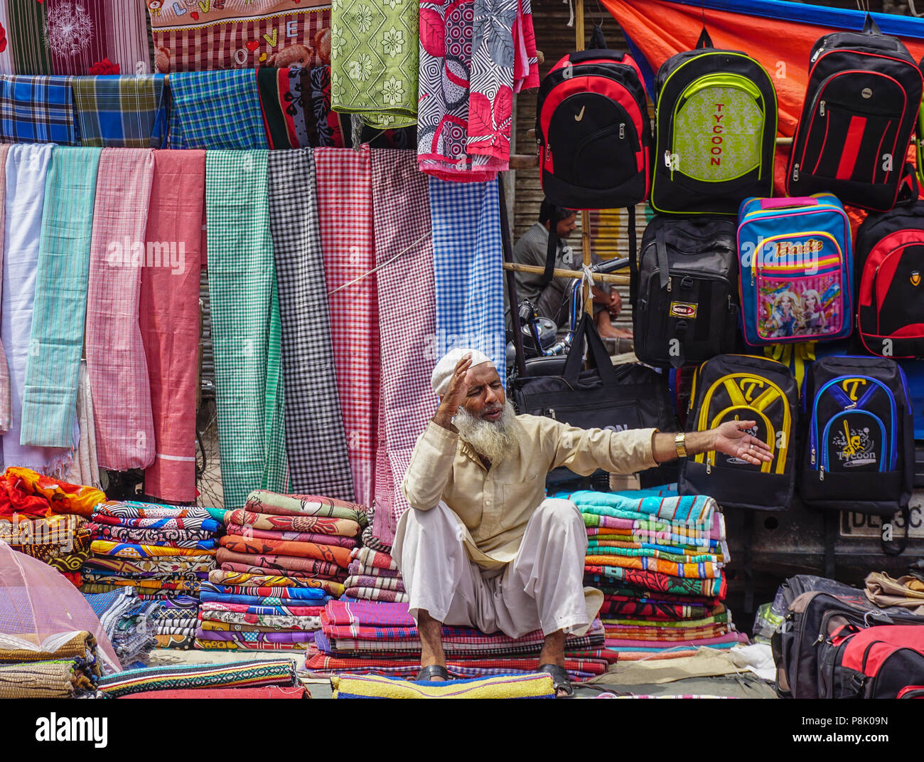 Jaipur, India - Nov 1, 2015. An old man selling clothes on street in ...