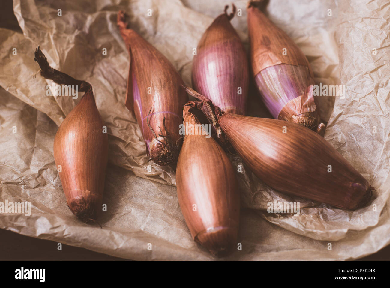 Close up food image of Shallots on a brown paper background Stock Photo ...