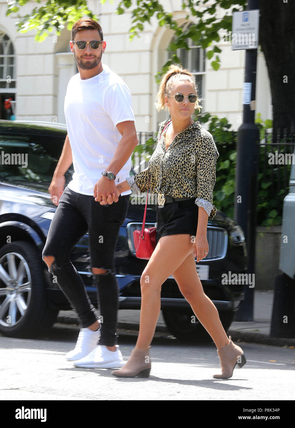 Caroline Flack and boyfriend Andrew Brady are seen walking around in ...