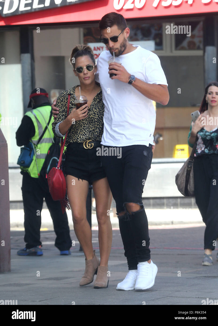 Caroline Flack and boyfriend Andrew Brady are seen walking around in ...
