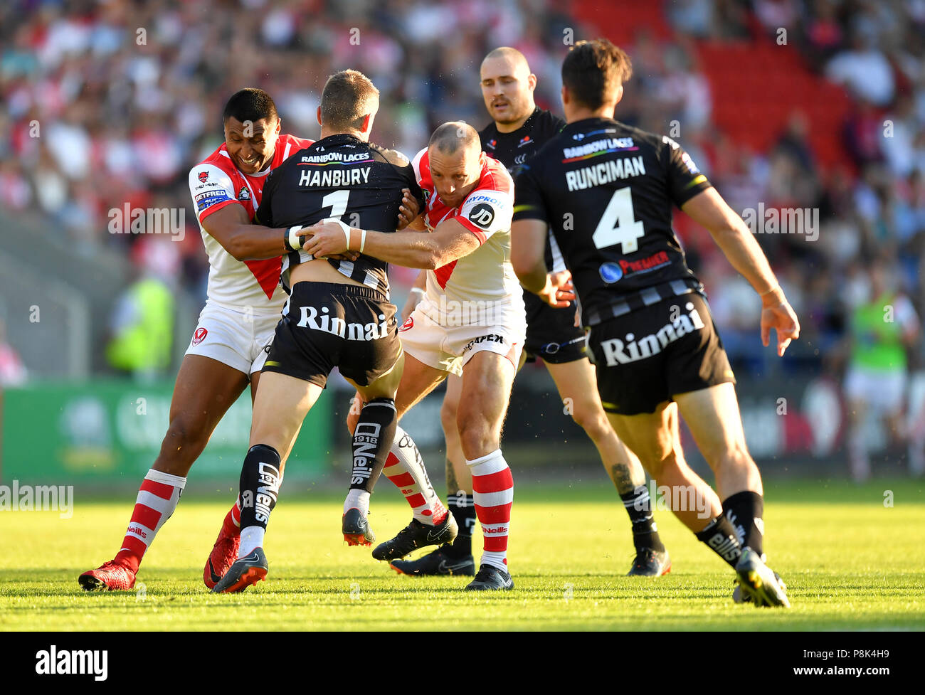 St Helen's Dominic Peyroux (left) and Adam Swift (centre) challenge ...
