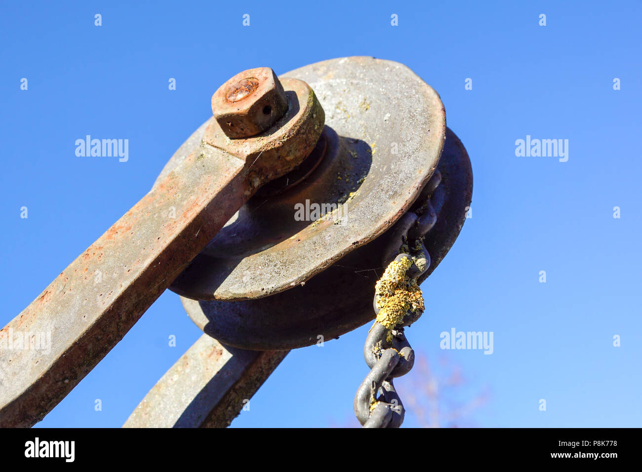 Rusted Iron pulley with chain used in wells for getting water Stock ...