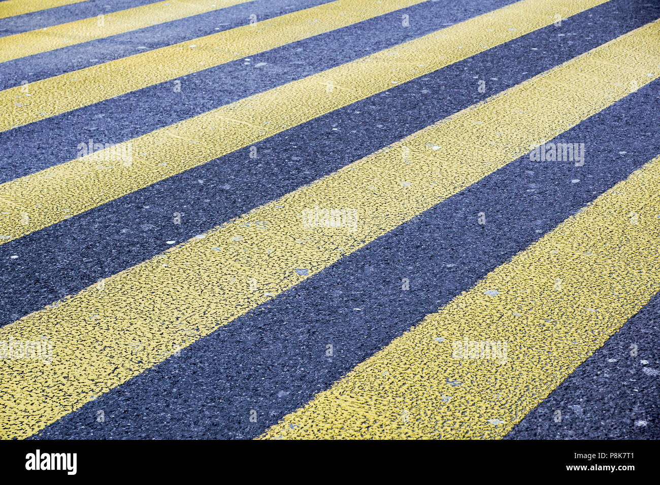 Level asphalted road with a dividing yellow stripes. The texture of the ...