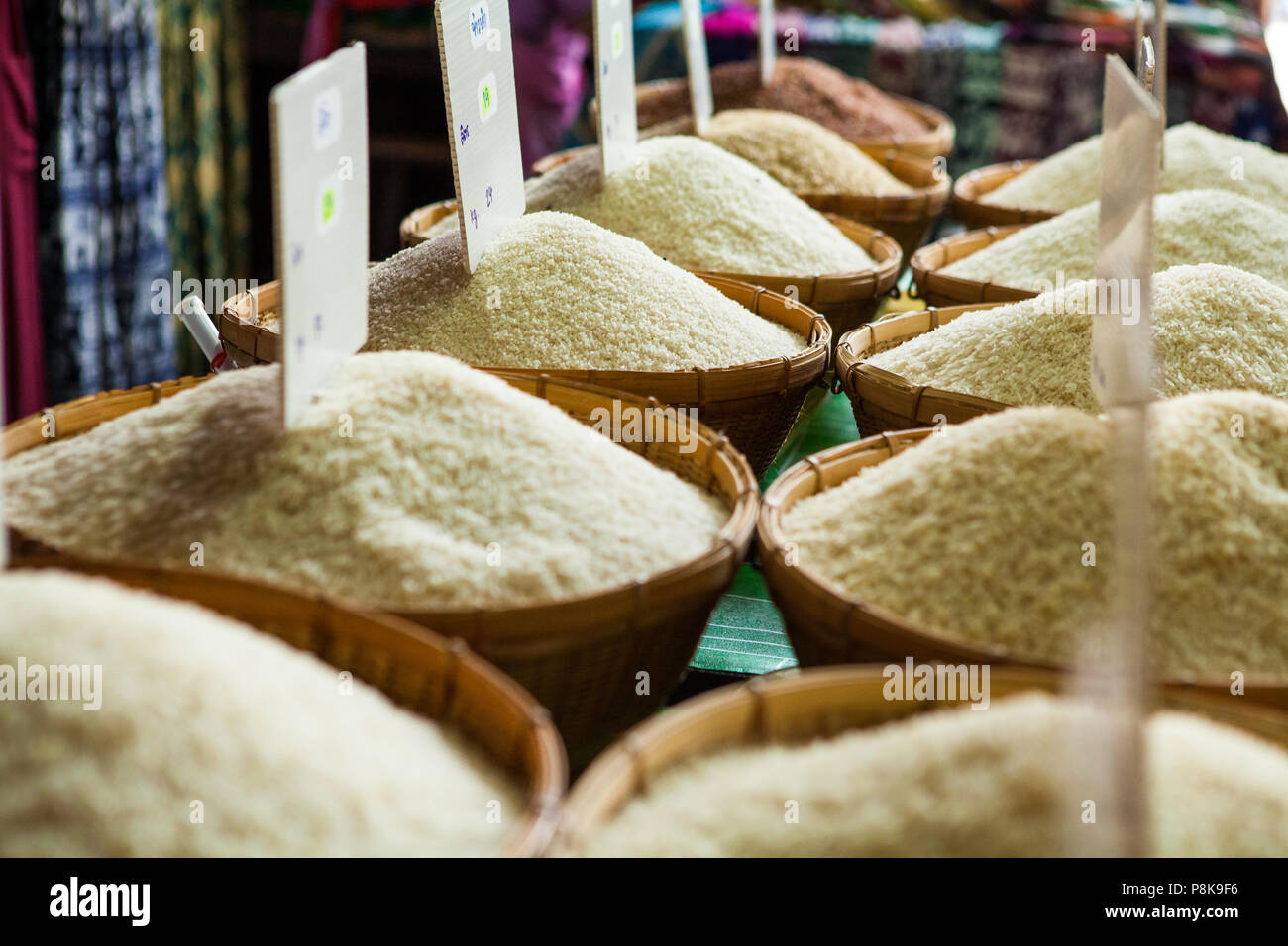 Large bowls of uncooked rice in a market in Thailand Stock Photo - Alamy