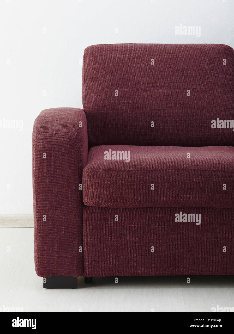 Sofa in white room. Close-up Stock Photo - Alamy