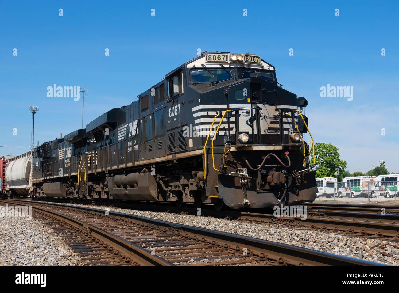 Twin diesel locomotive hauling freight through downtown Elkhart Indiana ...