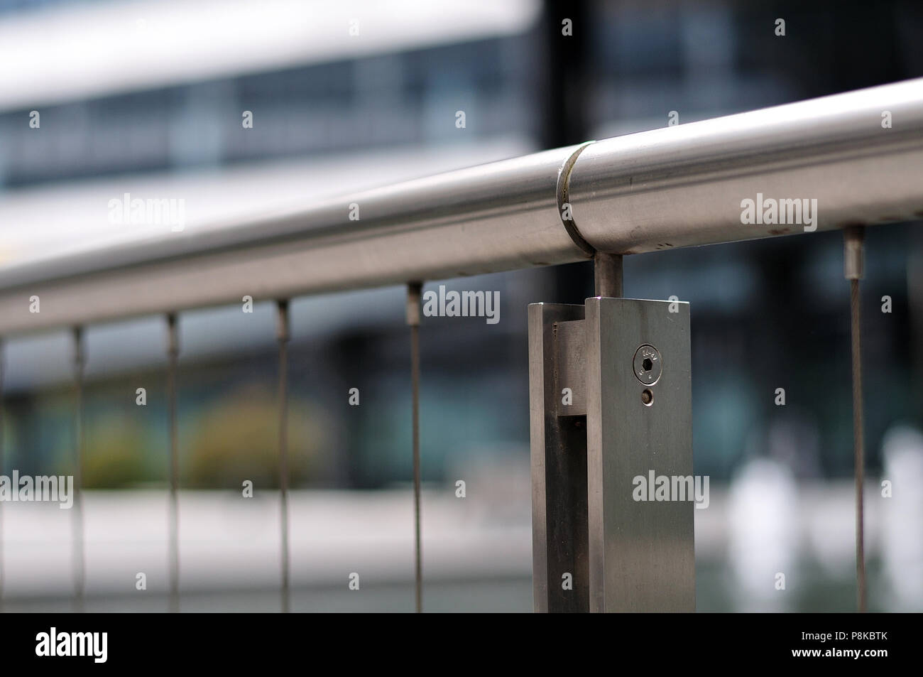 close-up of handrail of a bannister constructed with stainless steel ...