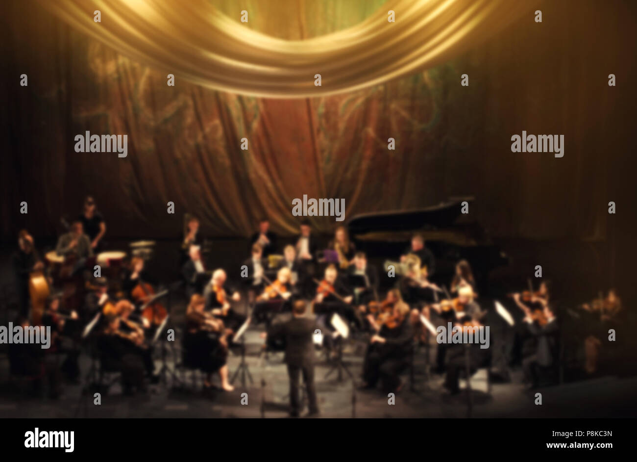 Artists symphony orchestra. abstract blurred image. Musician plays a ...