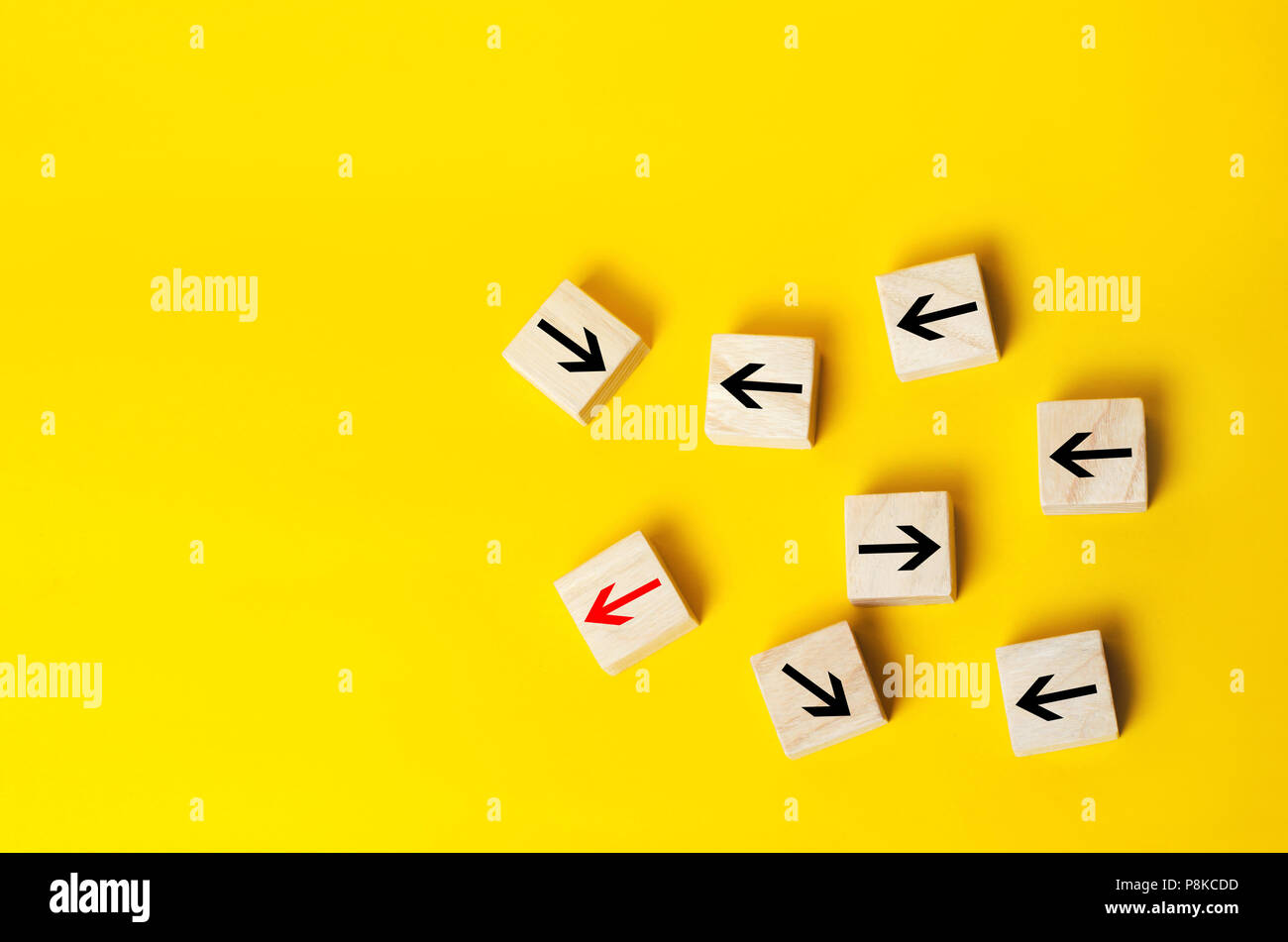 Wooden blocks with red arrow facing the opposite direction black arrows ...