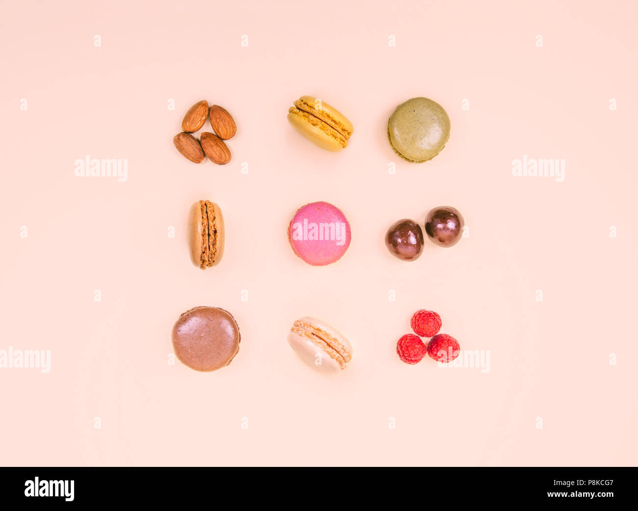 Colorful macaroons on the pink background Stock Photo - Alamy