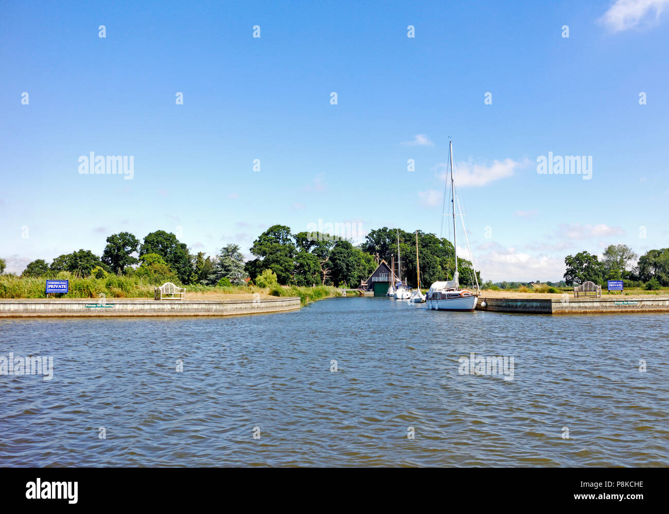 A view of private moorings off the River Bure on the Norfolk Broads at ...