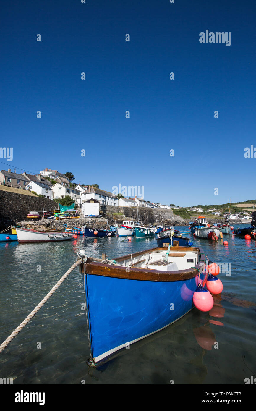 A picturesque view of traditional Cornish fishing boats floating in the ...