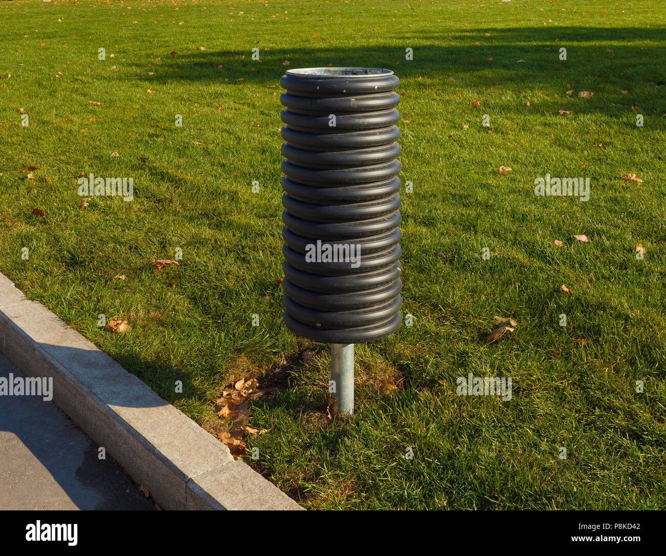 Trash can in pedestrian area Stock Photo - Alamy