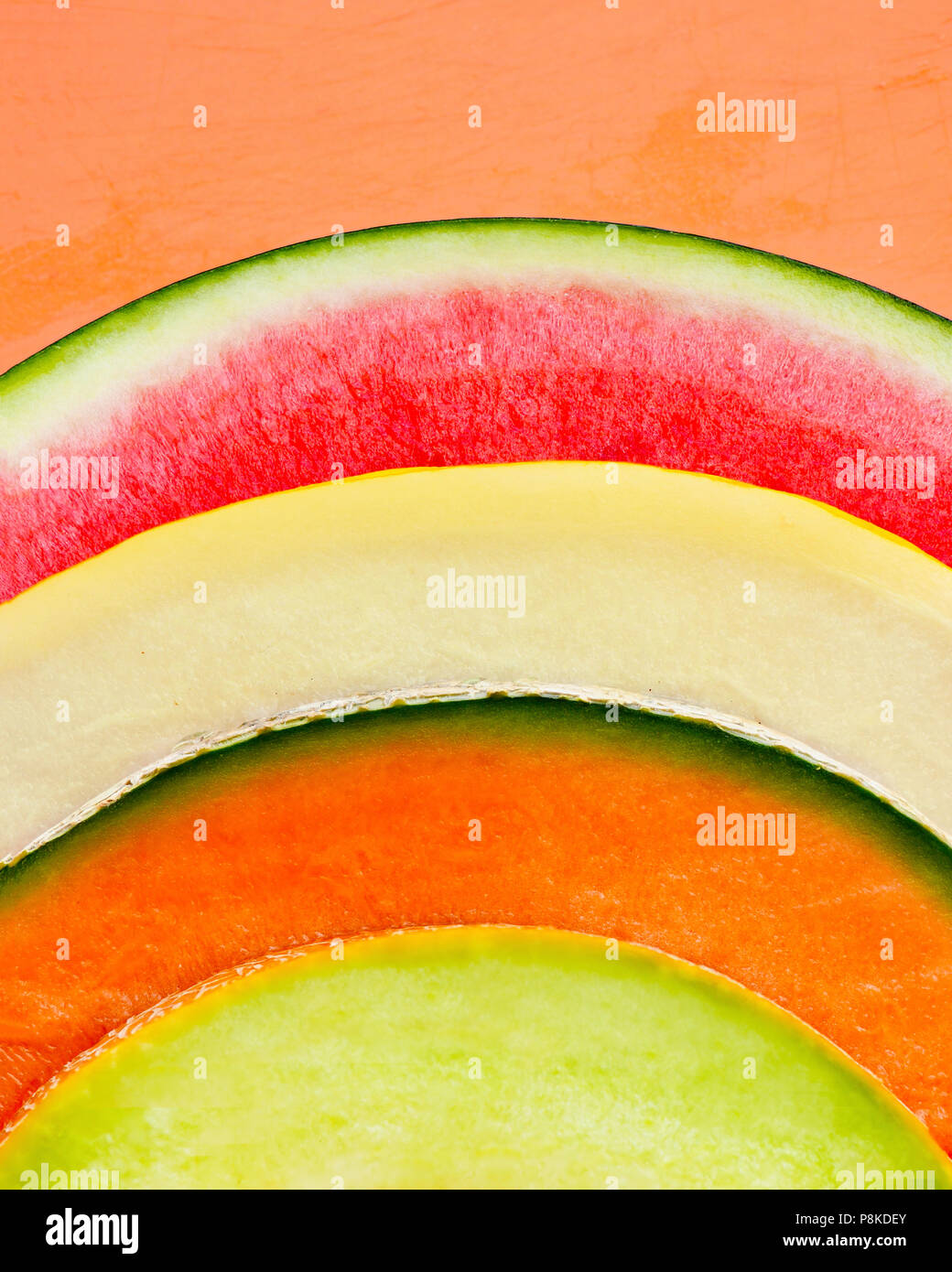 abstract of four different kinds of melon very coloful in a vetical ...