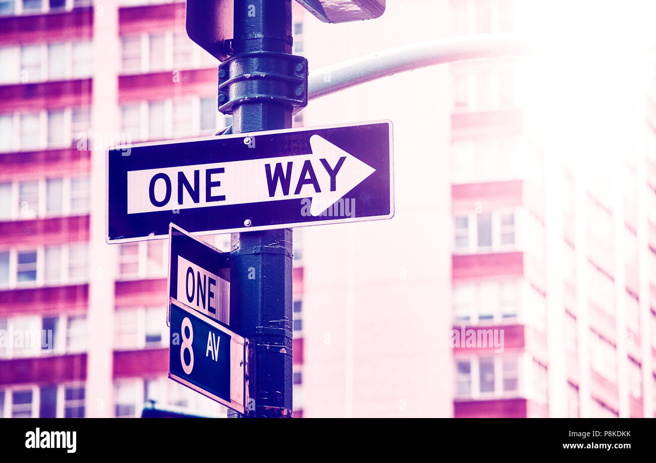 One way street sign at the 8th Av in Manhattan, color stylized picture ...
