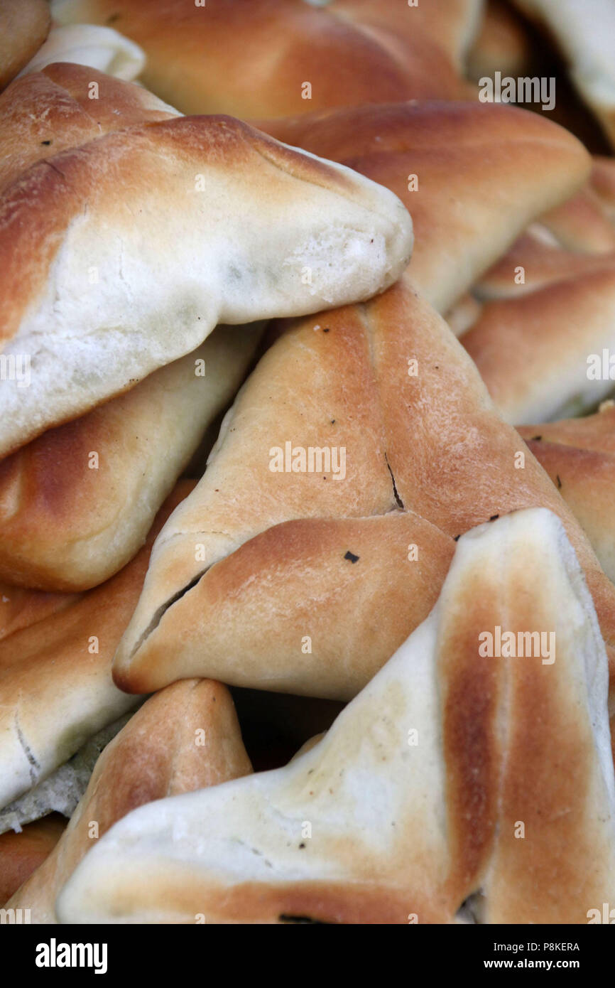 Triangle shaped Spinach Pie Stock Photo - Alamy